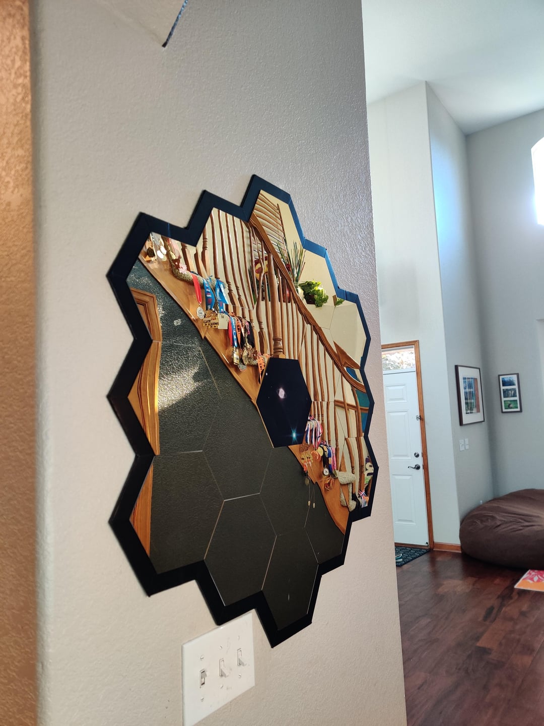 I made a JWST wall art with gold hex mirrors on a foam biard. The ...