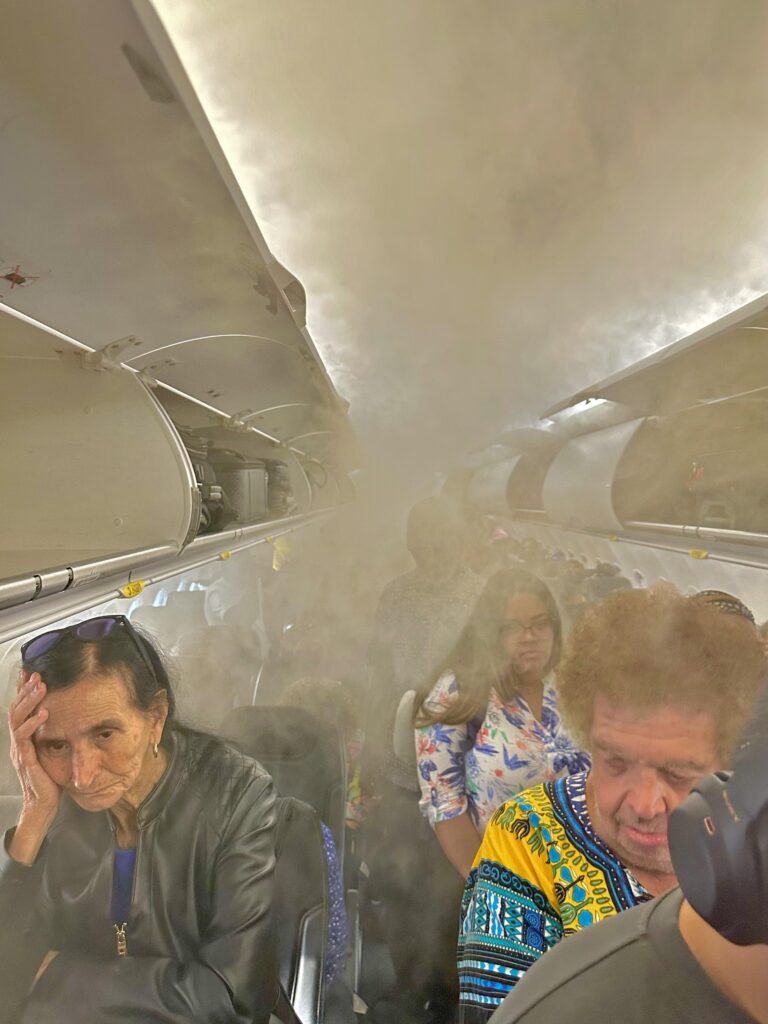 Spirit Airlines arriving in Colombia. Behind the lady wearing the white ...