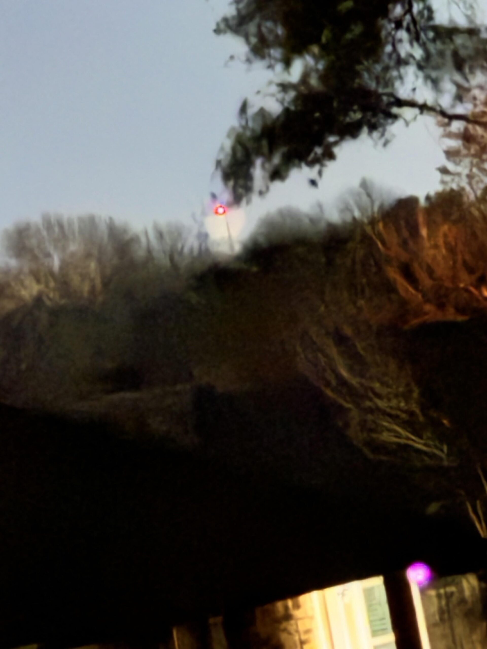 What is the object in the distance with the red light & what is the ...