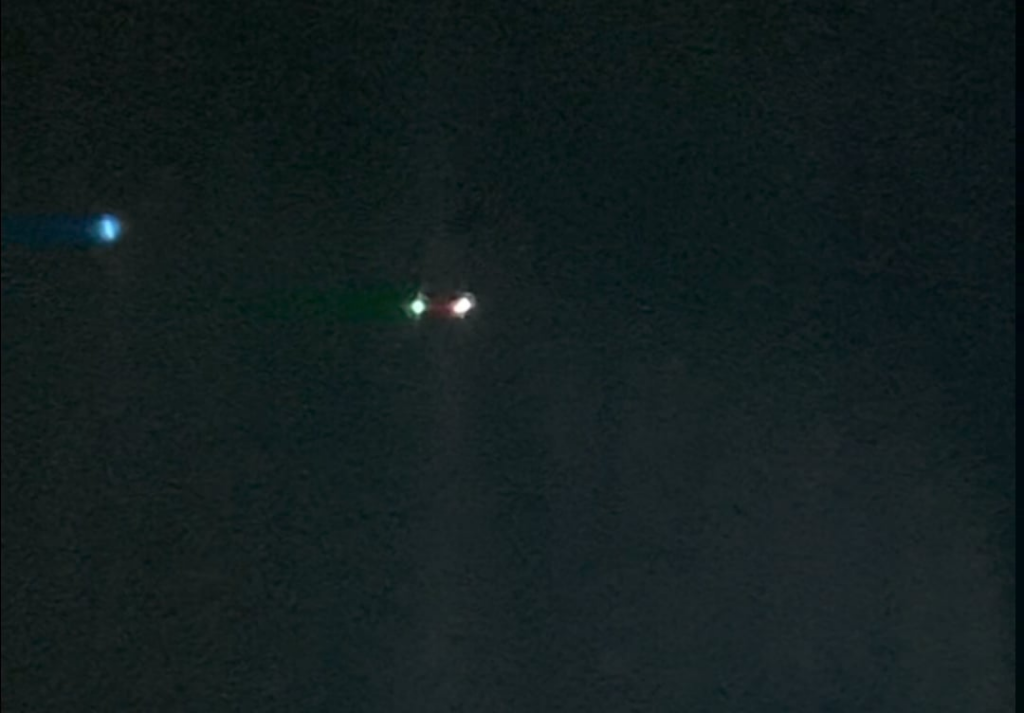 Strange orb following a military helicopter last night. - UFO FEED